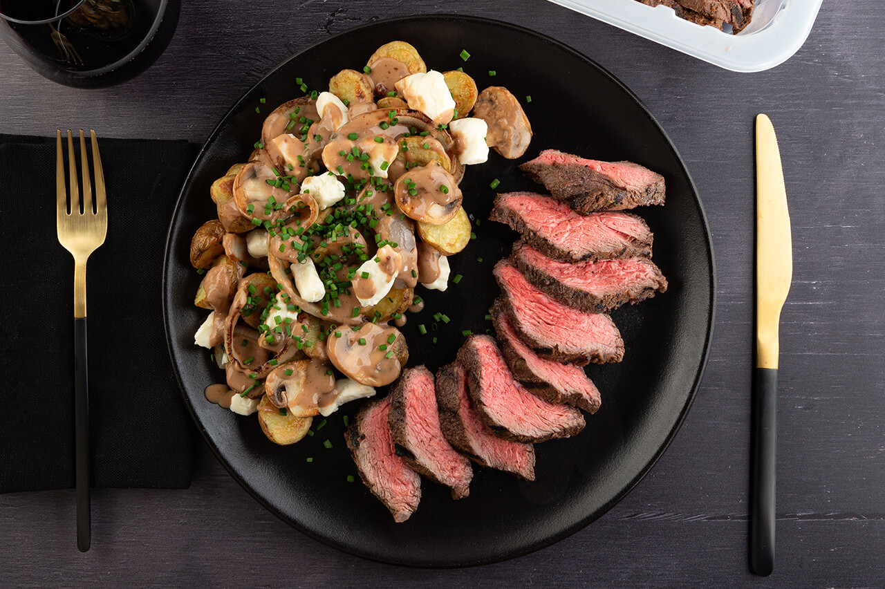 Grilled beef steak with creamy pepper and mushroom sauce